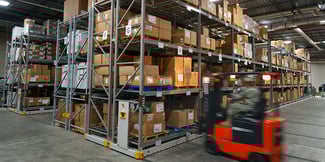 Reaching Operational Goals in Industrial Spaces With Mobile Racks Storage