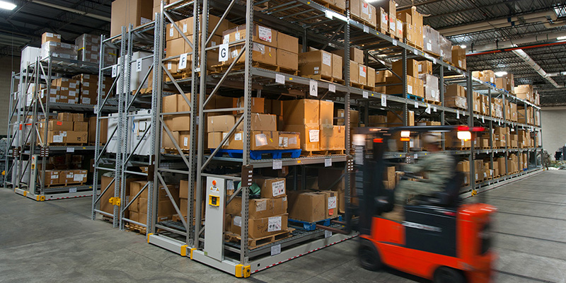 Reaching Operational Goals in Industrial Spaces With Mobile Racks Storage