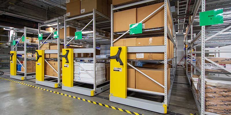 Reaching Operational Goals in Industrial Spaces With Mobile Racks Storage